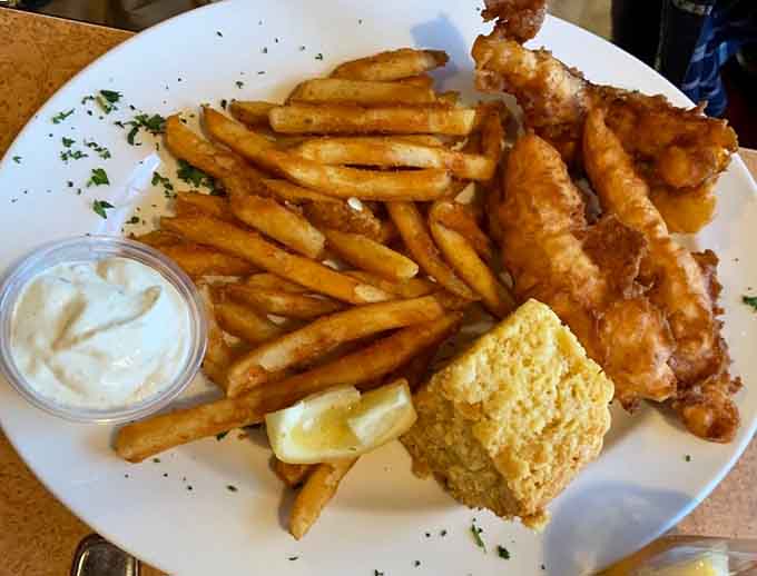 This perfectly fried fish showcases the ideal ratio of crunchy batter to tender, flaky interior that defines a truly exceptional fish fry experience.