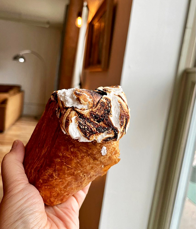 The lemon blueberry cruffin combines croissant technique with muffin charm, creating a pastry that's both sophisticated and comforting.