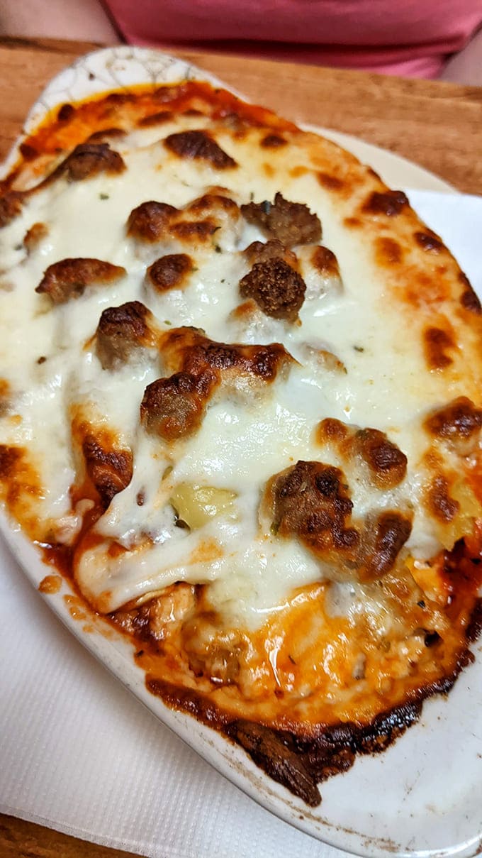 Layers of pasta, cheese, and sauce meld together in this bubbling masterpiece that would make any nonna nod in approval.