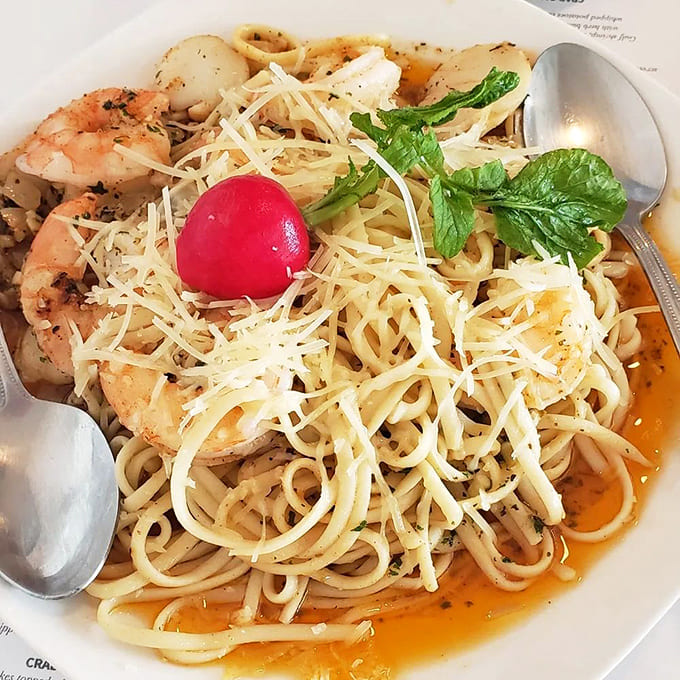 Linguine tangled with shrimp and scallops in a pasta embrace that would make any Italian grandmother smile with approval.