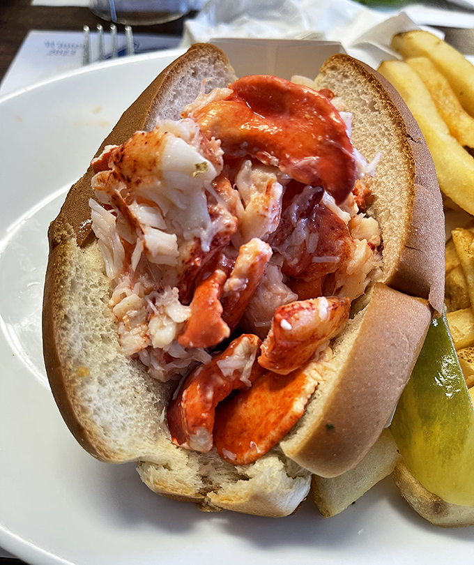 Lobster roll perfection: chunks of sweet meat barely dressed, allowing the ocean's bounty to speak for itself in this quintessential Maine experience.