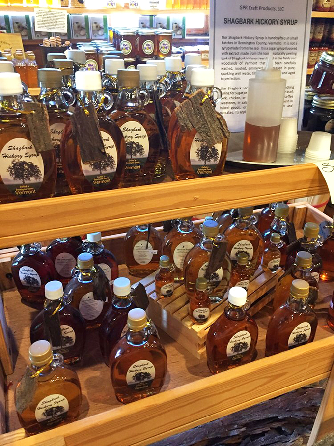 Liquid gold in bottles: Vermont's signature syrup collection gleams like a treasure chest of breakfast possibilities.