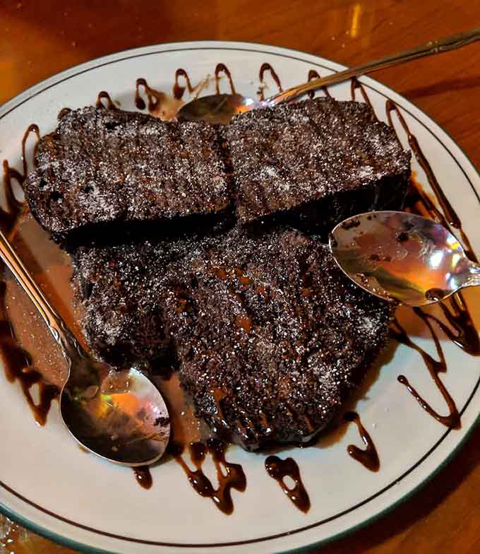 That chocolate cake is so rich and decadent, it should probably come with a warning label and maybe a nap afterward.