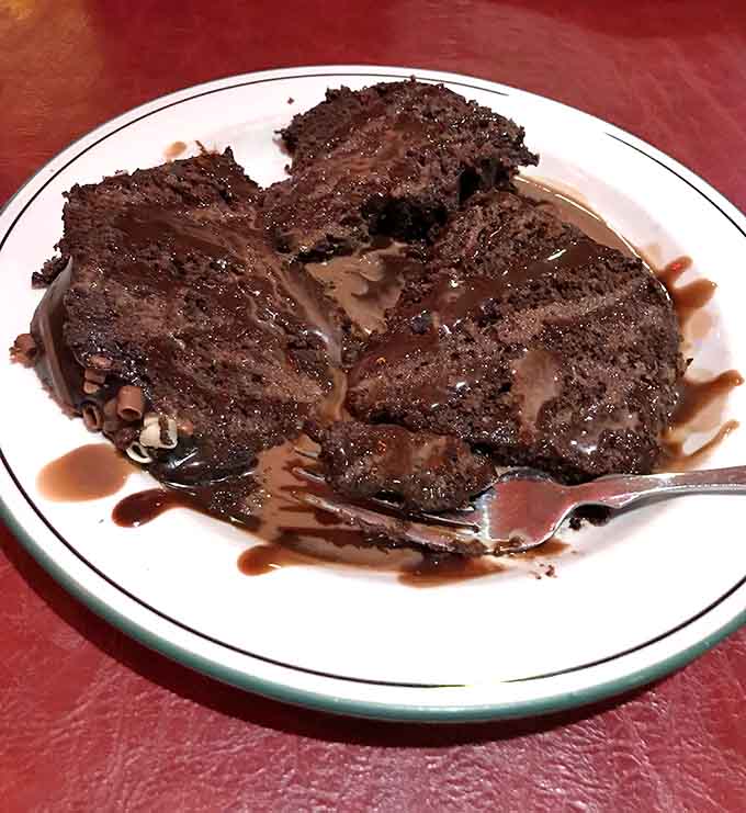 Layers of chocolate decadence that would make Willy Wonka weep with envy, artfully presented and impossibly delicious.