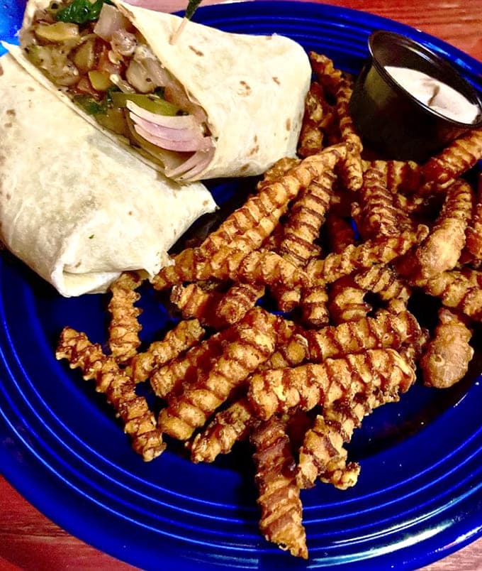 Look at those perfectly crispy waffle fries playing supporting actor to the wrap's leading role, both deserve awards.