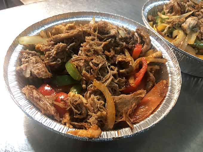 When fajitas arrive sizzling like this, every diner within earshot suddenly questions their own menu choices and experiences immediate order envy.