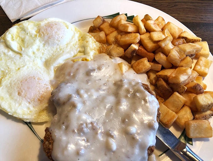 When your breakfast plate requires architectural support and comes with its own gravitational pull, you know you've ordered correctly.