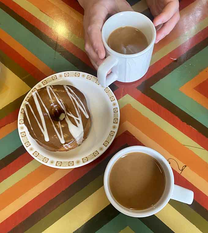 Two cups of coffee and donuts that prove vegan baking has come a long way from the cardboard days of yesteryear.