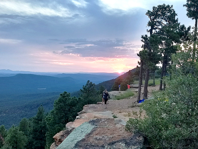 Engineering meets nature as the viewing platform nestles beneath the travertine giant, offering humans a safe perch to contemplate geological time.