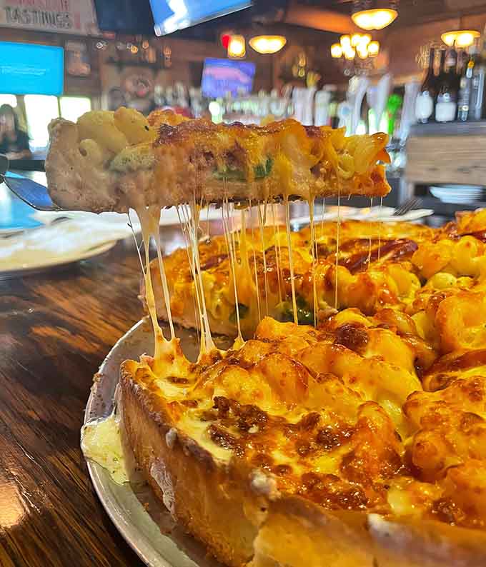 Mac and cheese on pizza? Someone finally answered prayers we didn't know we were praying, and it's glorious.