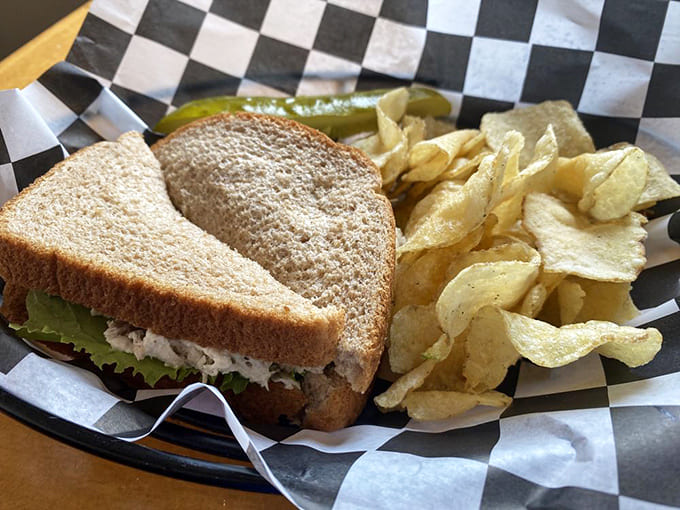 That golden-toasted bread and generous chicken salad filling come with chips and a pickle, because some traditions just make sense.