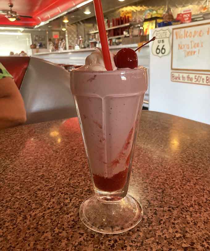 A cherry-topped strawberry shake that would make even the Fonz say "Ayyyy!" sits ready for its close-up and your taste buds.