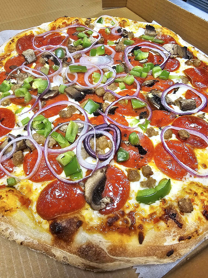 The Newbury Supreme showcases the art of balance &ndash; every colorful topping playing its part in this harmonious pizza performance.