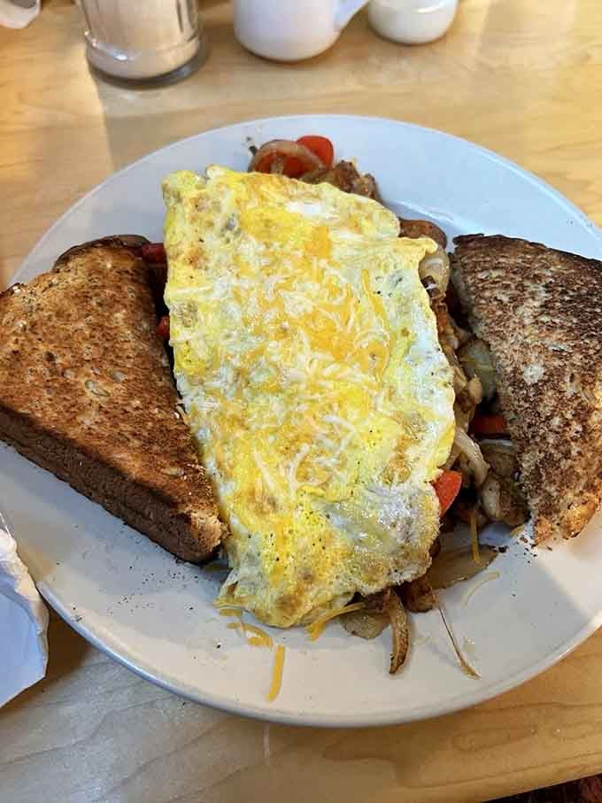 This loaded skillet proves that sometimes more really is more, especially when it involves eggs, potatoes, and melted cheese.