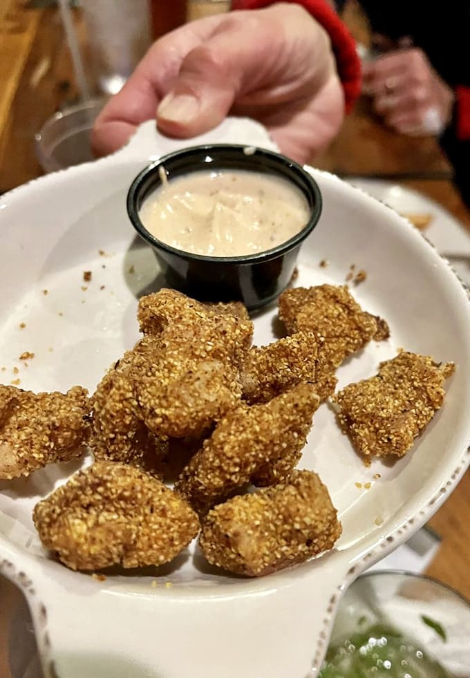 These golden nuggets of fried catfish prove that good things come in crispy, perfectly-seasoned packages with creamy dipping sauce.