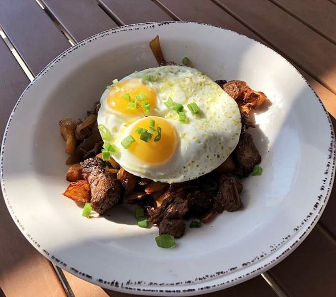 Brisket hash topped with perfectly fried eggs: breakfast just became the most important meal ever.