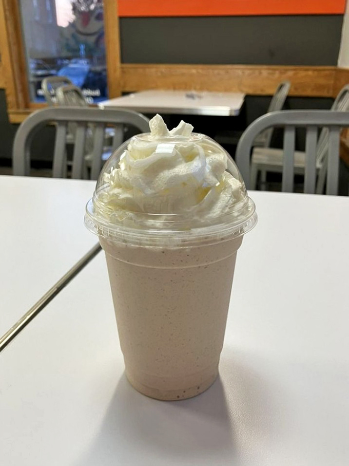 The legendary Nutella milkshake arrives with a mountain of whipped cream, promising a hazelnut-chocolate experience worth crossing state lines for.