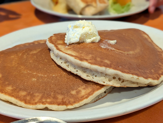 These aren't just pancakes &ndash; they're golden-brown clouds of joy, perfectly cooked with that ideal balance of crisp exterior and tender center.