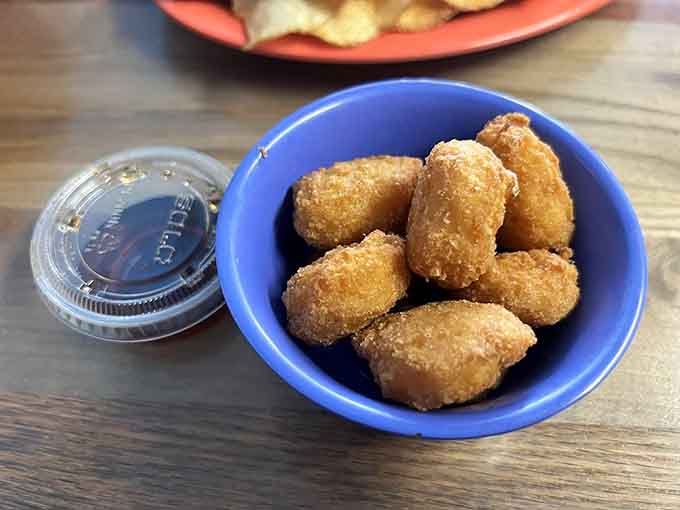 Golden corn puffs deliver sweet, crispy satisfaction that'll have you ordering a second bowl before finishing the first.