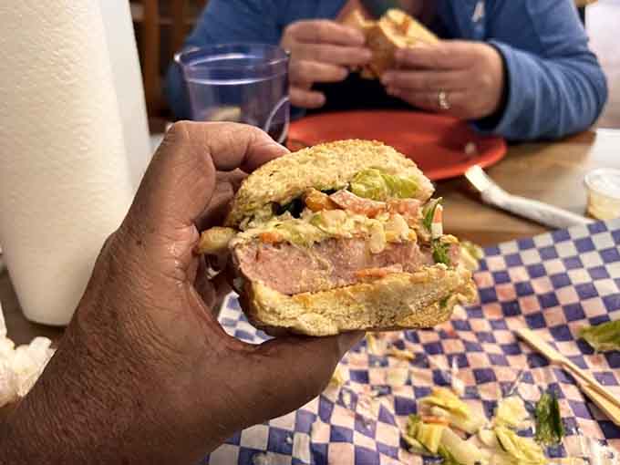 That cross-section reveals layers of fried SPAM, fresh vegetables, and remoulade sauce working together like a delicious United Nations.