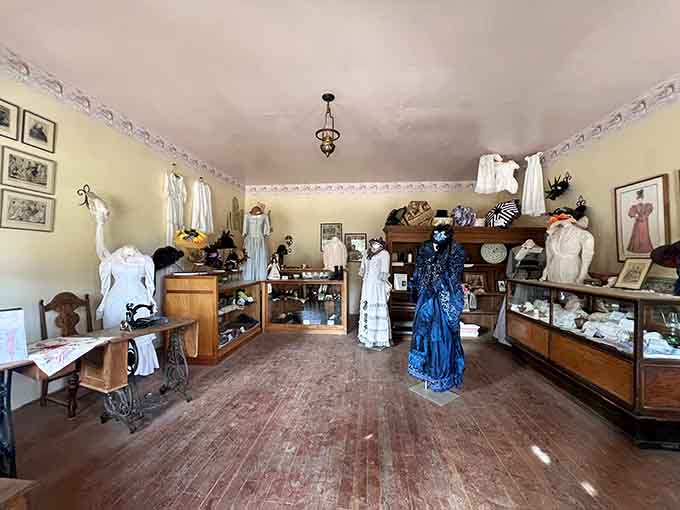 The dress shop displays period fashions and sewing equipment, revealing how frontier women maintained style and dignity despite challenging circumstances.