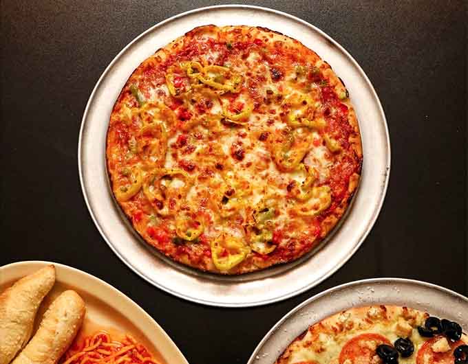 Those banana peppers aren't just decoration, they're flavor bombs waiting to explode across your taste buds with tangy perfection.