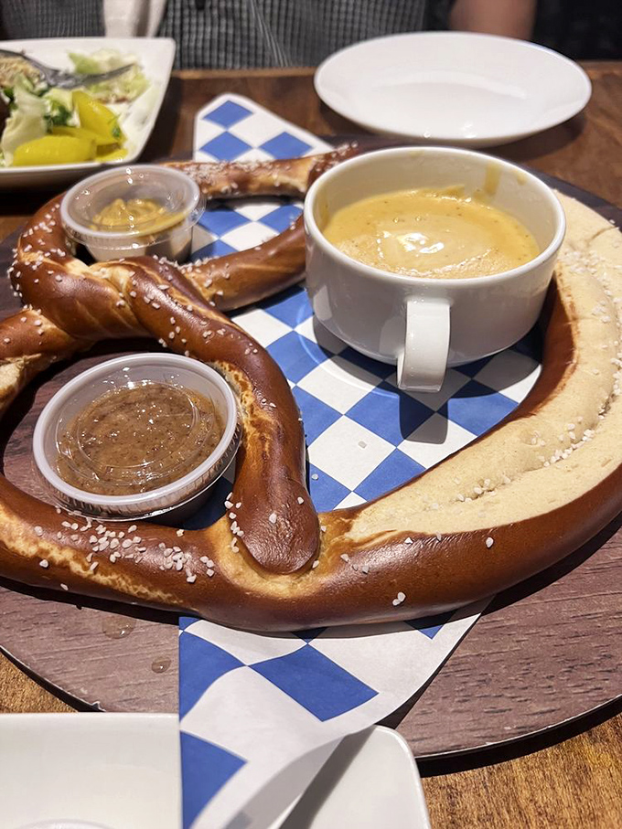 The pretzel arrives like a carb-loaded work of art &ndash; gorgeously bronzed, properly salted, and accompanied by mustard that demands to be slathered generously.