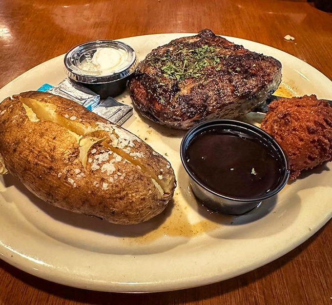 This isn't just any pork chop – it's a masterclass in meat preparation, topped with a cranberry-raspberry sauce that dances between sweet and tart.