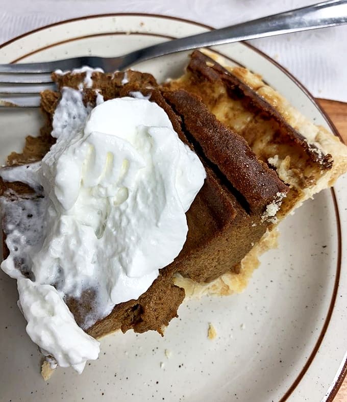 Pumpkin Pie: Autumn on a plate &ndash; velvety smooth filling topped with a cloud of whipped cream that melts into spiced perfection.