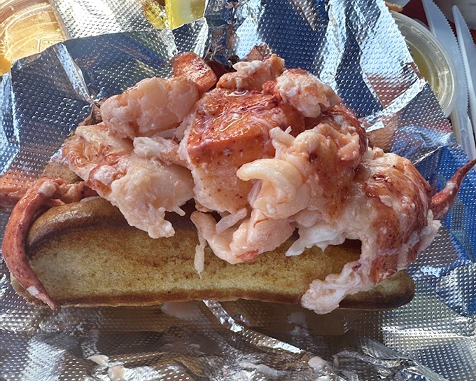 The famous overstuffed lobster roll in all its glory &ndash; where the lobster doesn't just fill the bun, it completely overwhelms it with oceanic generosity.