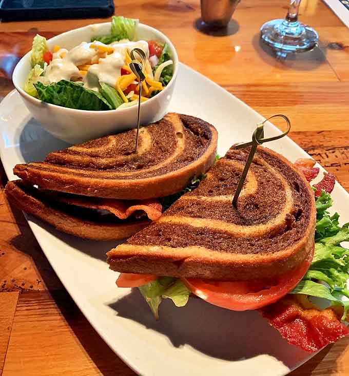 Marble rye swirls create an artistic canvas for this sandwich masterpiece, proving that grilled cheese can indeed be sophisticated.