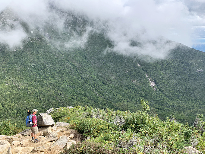 Morning mist dances across the mountain face, creating an ethereal scene worthy of fantasy novels and daydreams alike.
