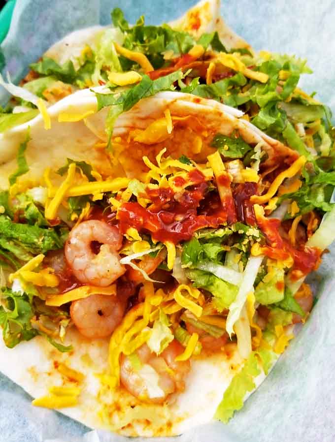 Shrimp tacos proving that seafood belongs in tortillas just as much as any land-based protein does.