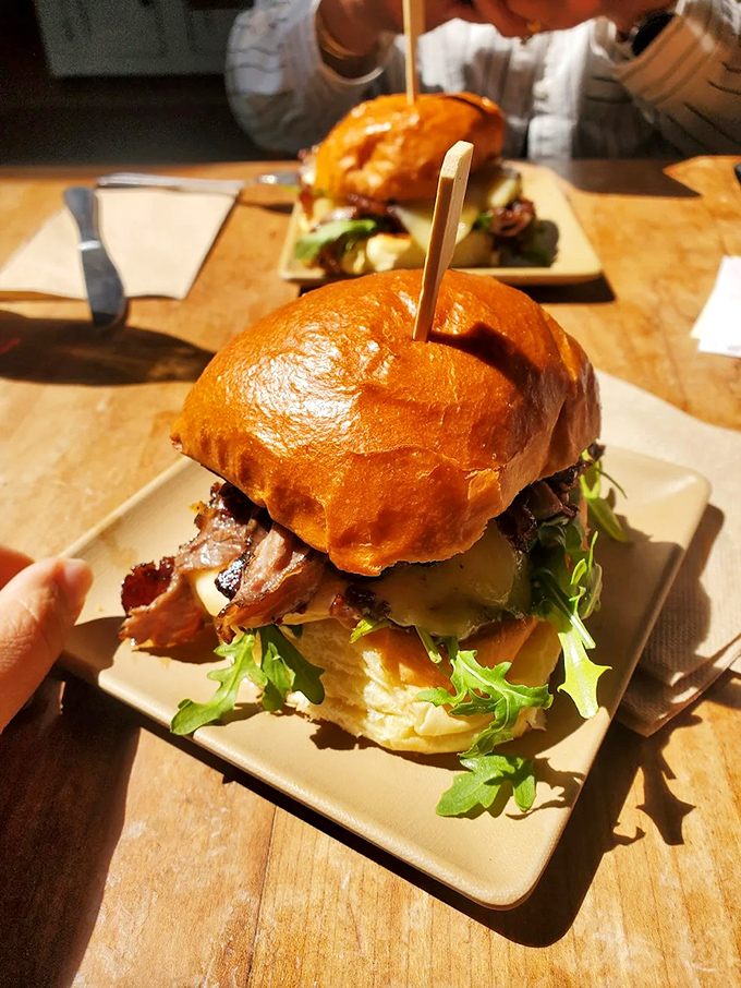 Architectural marvels of flavor stacked between house-baked bread &ndash; these aren't just sandwiches, they're handheld happiness.