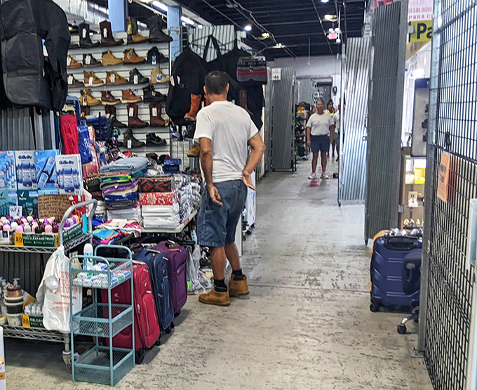 Footwear and luggage line the walkways &ndash; because who doesn't need new shoes and something to carry their flea market finds home in?