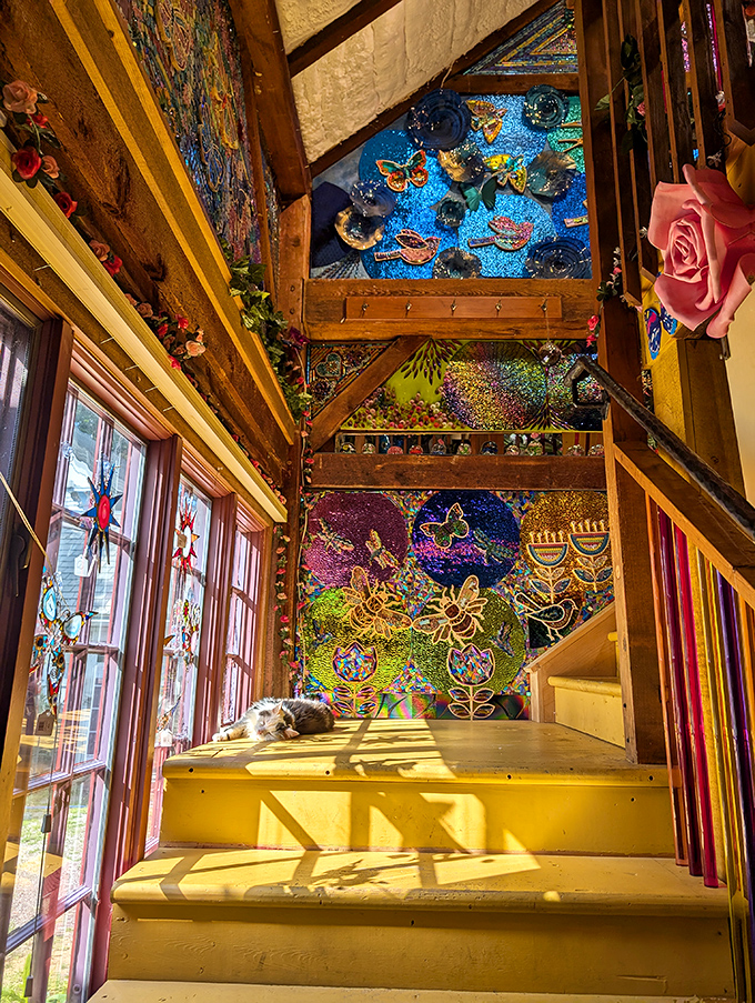Who needs a stairway to heaven when you've got this kaleidoscopic ascent? Even the resident cat seems mesmerized by the ceiling's cosmic celebration.