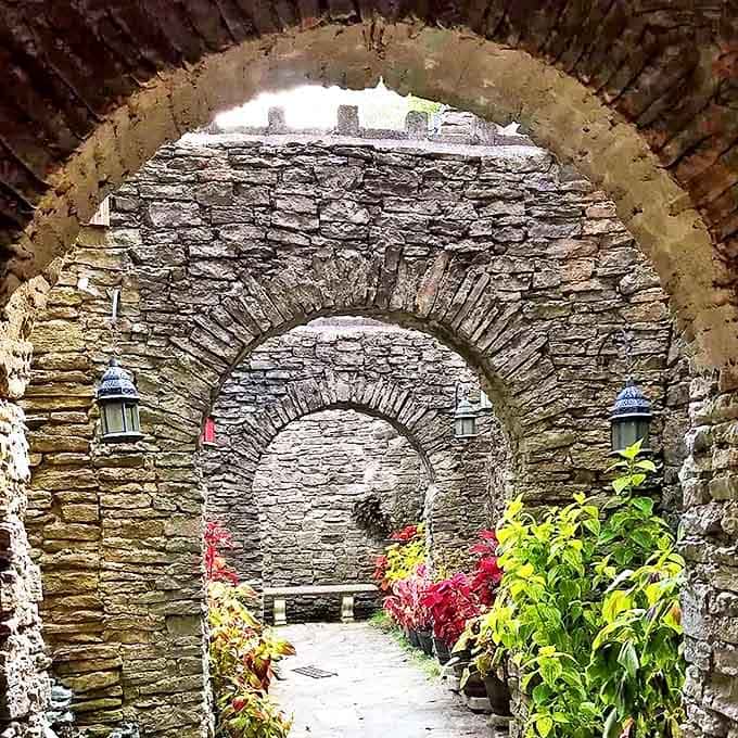 Stone archways create magical frames for the gardens beyond &ndash; each one a portal to another part of this handcrafted wonderland.