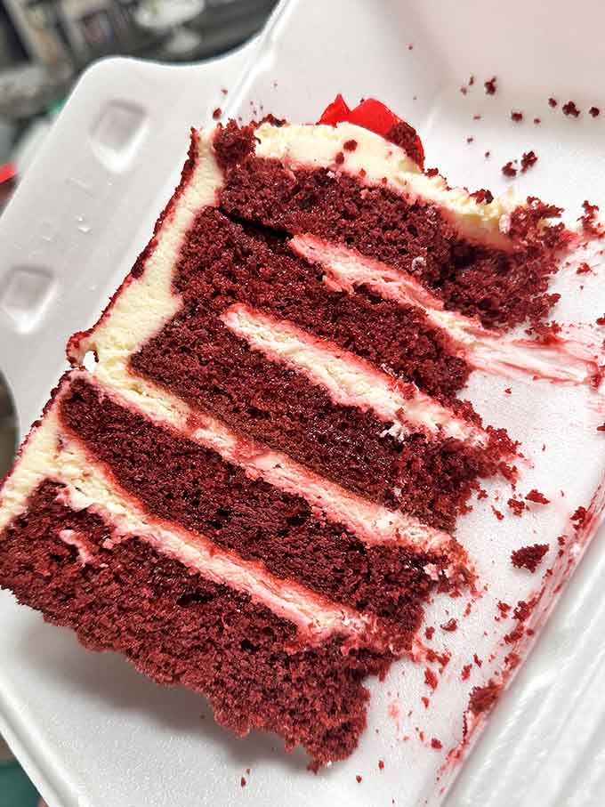Red velvet perfection in five glorious layers &ndash; this isn't just cake, it's an architectural marvel with cream cheese mortar between each floor.