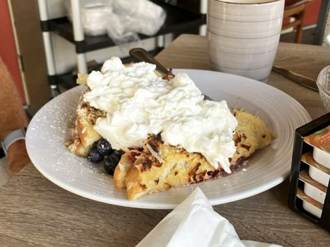 Coconut French toast that transports you to a tropical vacation with each heavenly, cream-filled bite.
