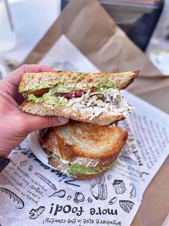 A perfect marriage of tender chicken, creamy avocado, and crisp vegetables creates a sandwich that makes you wonder why all lunches can't taste this good.