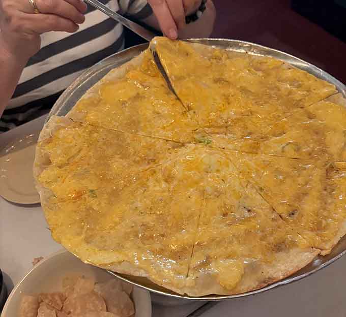 This isn't just dinner, it's a cheese-covered work of art that stretches the definition of perfection with every gooey bite.