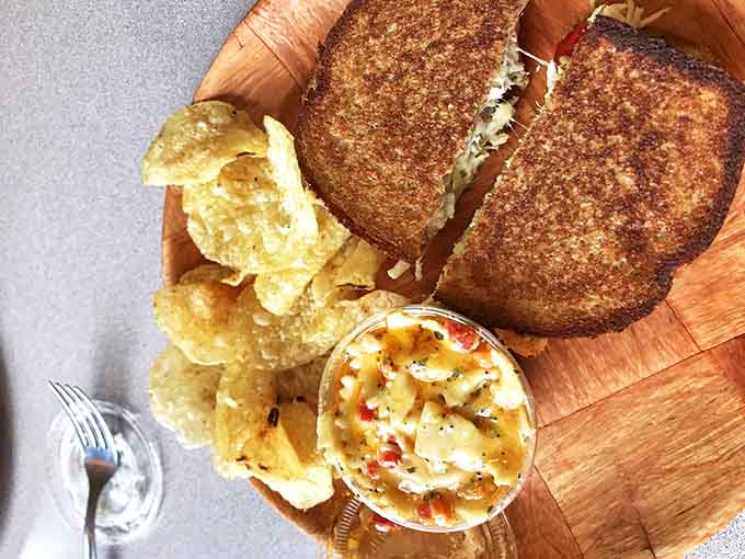 The Telluride Grilled Cheese showcases the perfect marriage of sharp cheddar, Swiss, and provolone with fresh avocado and tomato.