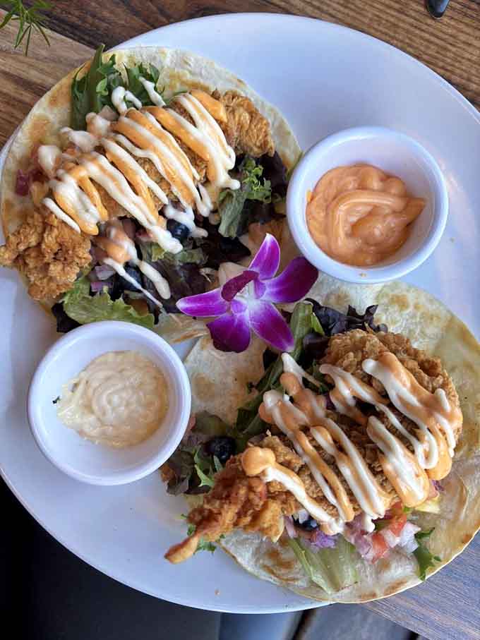 Golden-fried lobster meets fresh greens and creamy drizzles in a taco that'll ruin all other tacos for you.