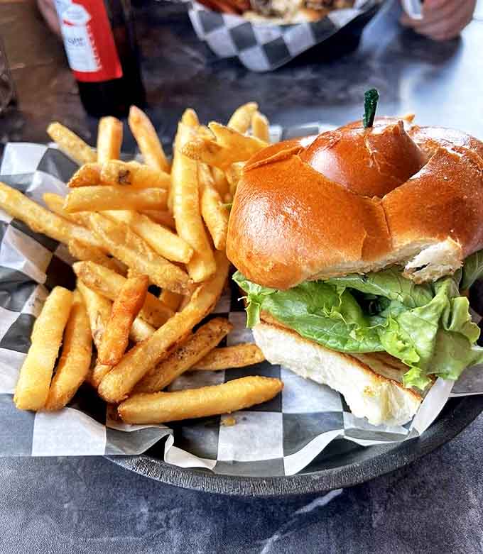 When your cheeseburger requires architectural planning to eat without incident, you know you're in the right place for serious comfort food.