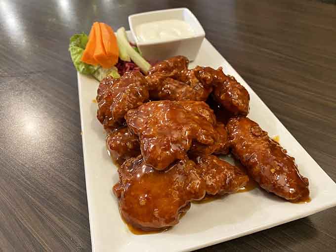 These boneless wings wear their sweet chili glaze like a badge of honor, crispy and saucy in equal measure.