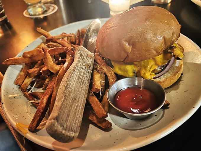 Those hand-cut fries aren't playing around, piled high and seasoned right, making every burger's perfect crispy companion.