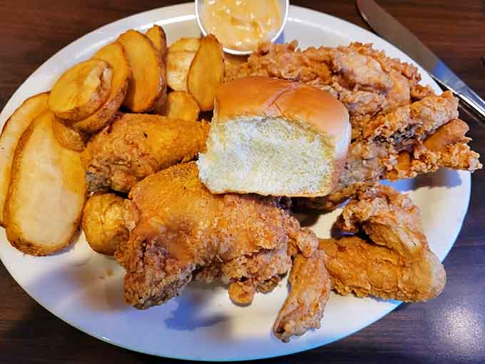 Fried chicken, potato wedges, and a roll create the holy trinity of comfort food that'll make you forget every diet you've ever considered.