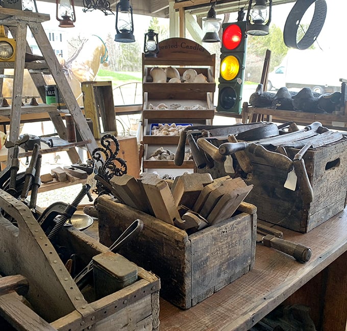 Weathered wooden toolboxes cradle implements from another era &ndash; when craftsmanship was measured by calloused hands, not digital precision.