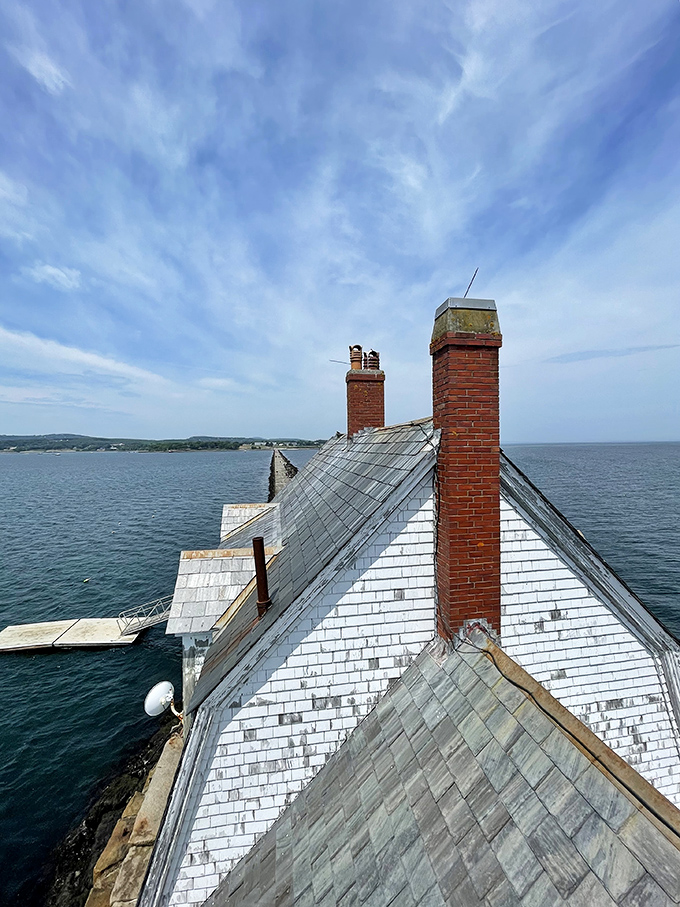 Looking up at the lighthouse's distinctive roof and brick chimney stacks &ndash; architectural details that have withstood over a century of Atlantic storms.