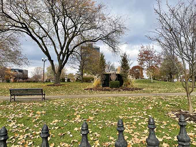 The bare trees of late autumn frame these evergreen sculptures, proving that even in the off-season, this park refuses to be boring.